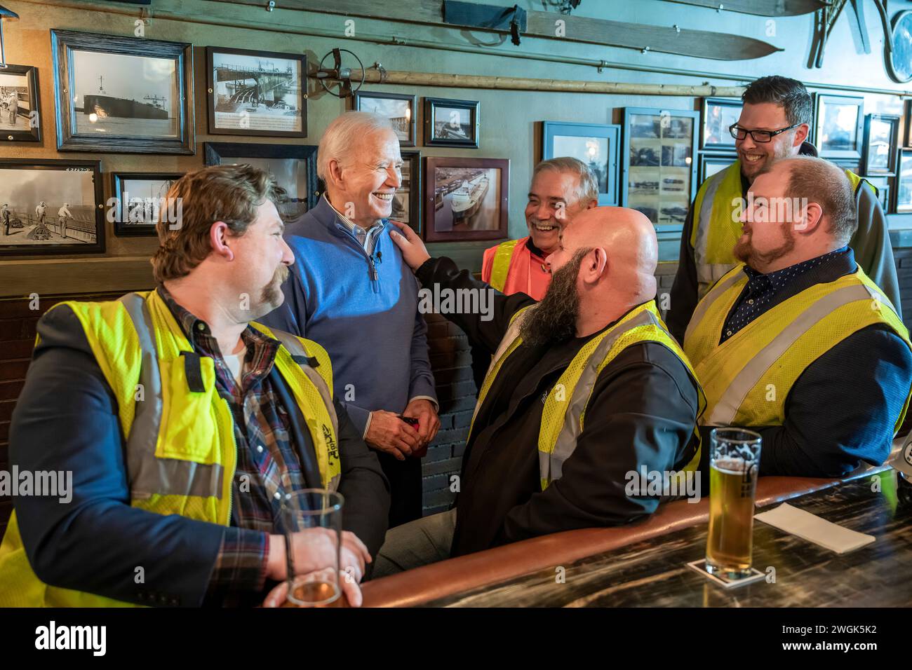 President Joe Biden greets employees and community members in the Cedar ...