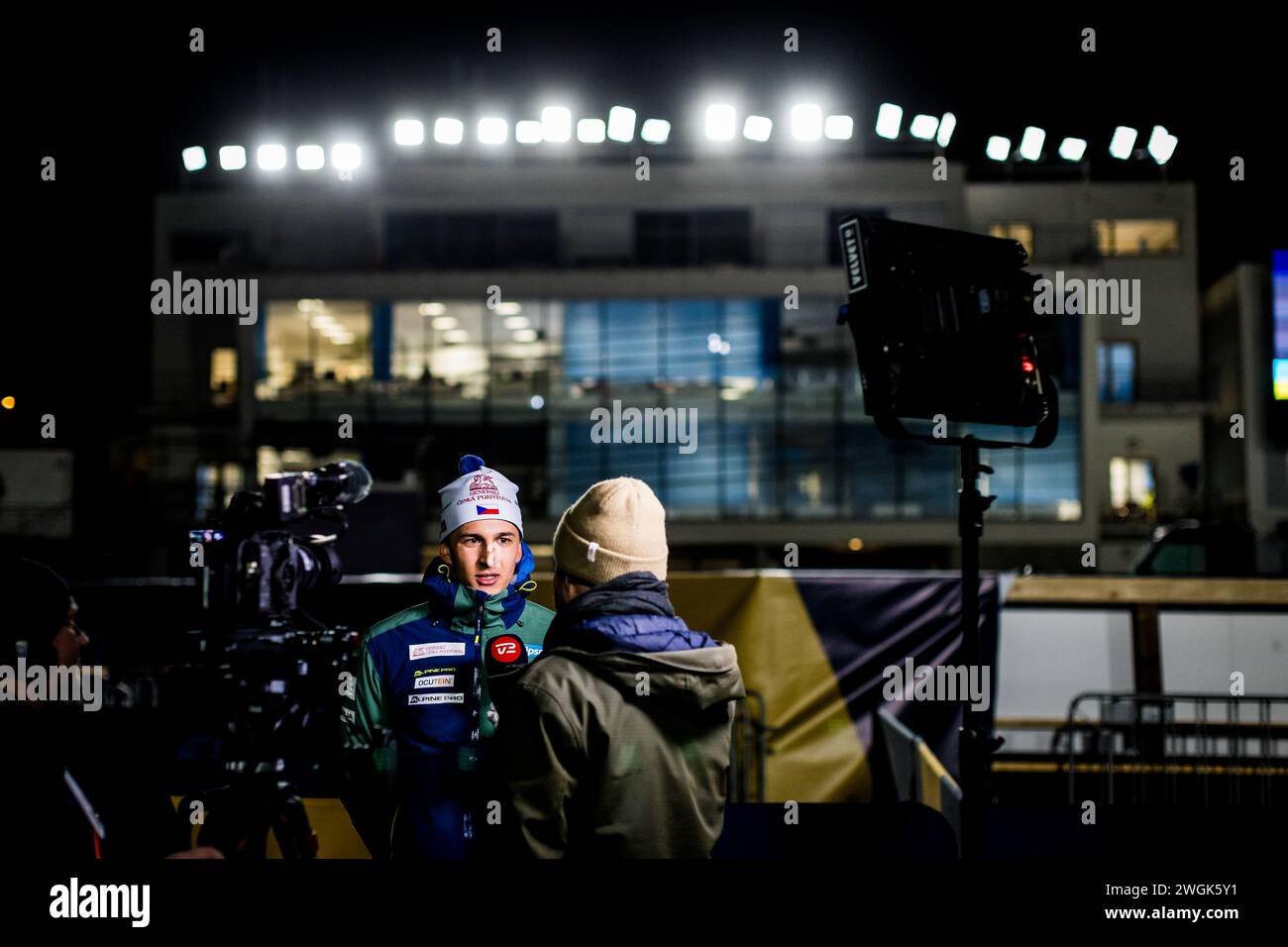 Czech biathlete Jonas Marecek speaks to a journalist during a media ...