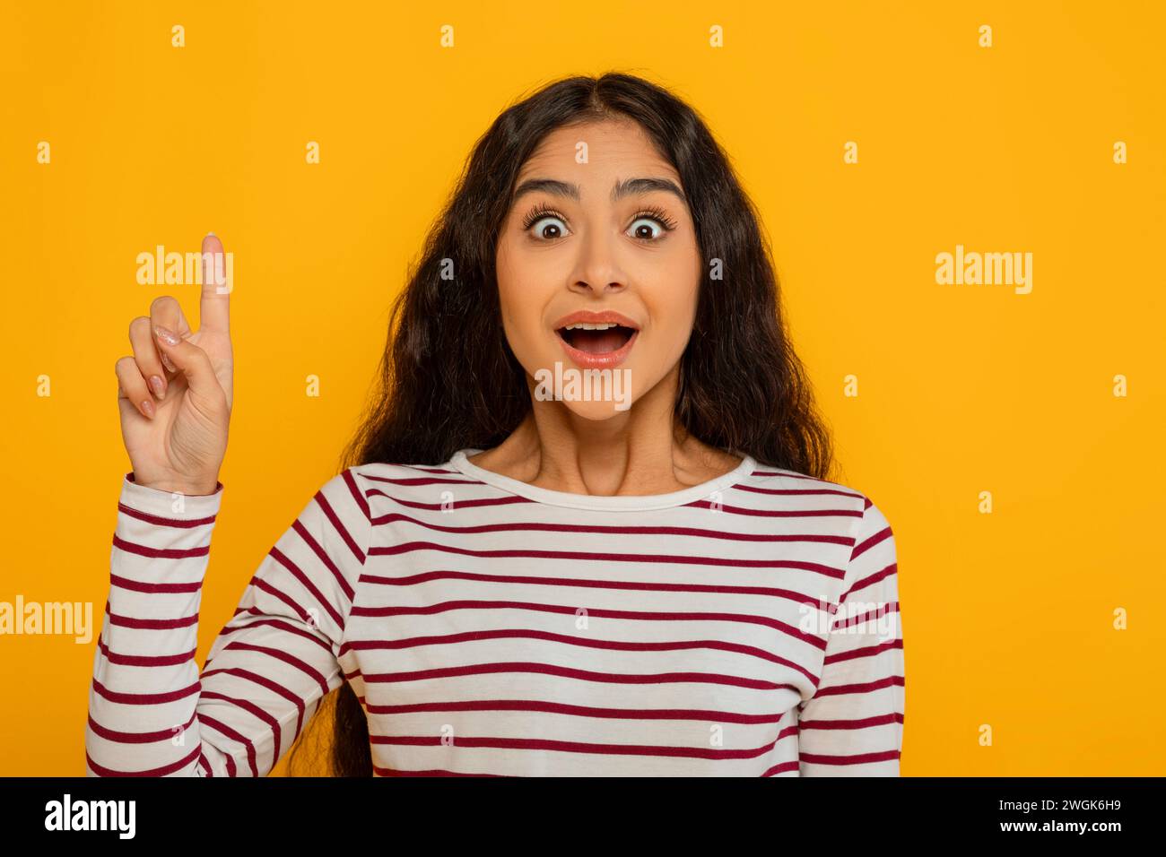 Inspired young indian woman showing eureka gesture Stock Photo - Alamy