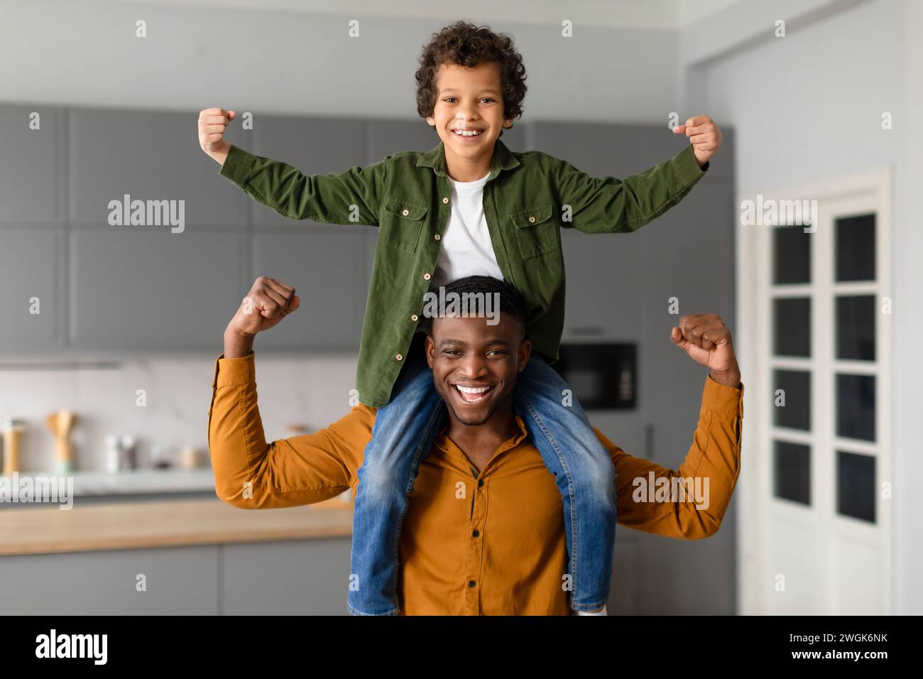 Father son flexing muscles hi-res stock photography and images - Alamy
