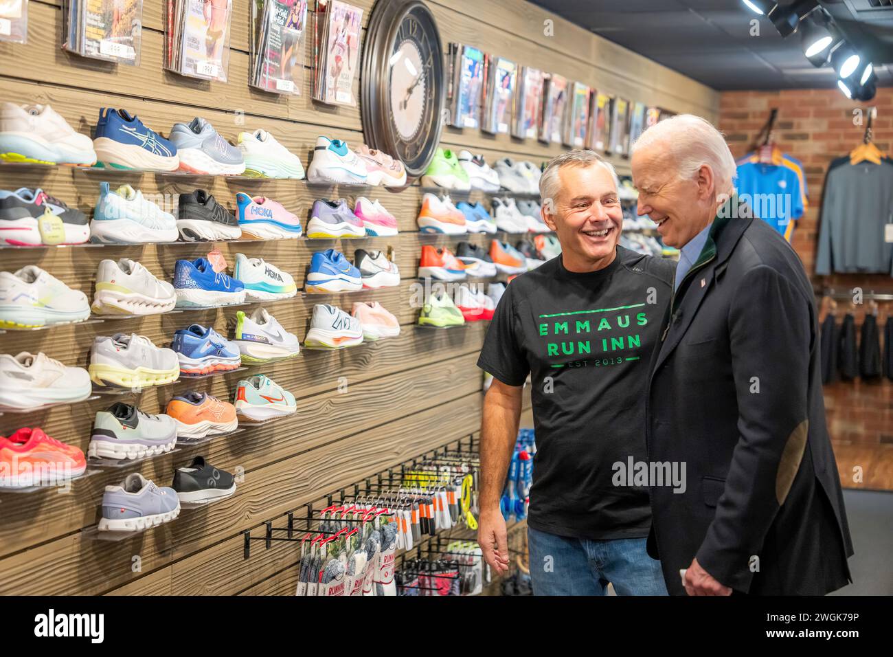 President Joe Biden greets owner Sean Linehan, Nicole Linehan, and ...