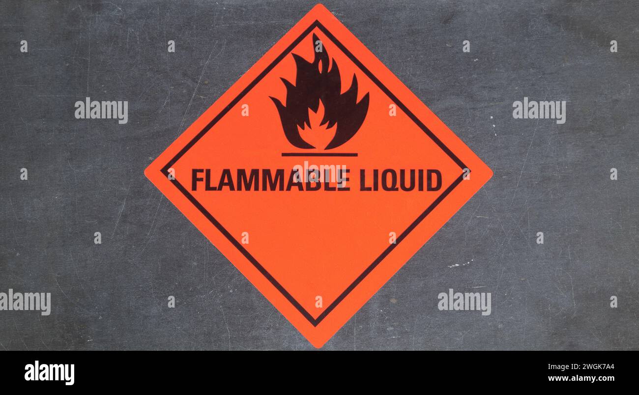 Flammable liquid sticker on gray stone background Stock Photo - Alamy