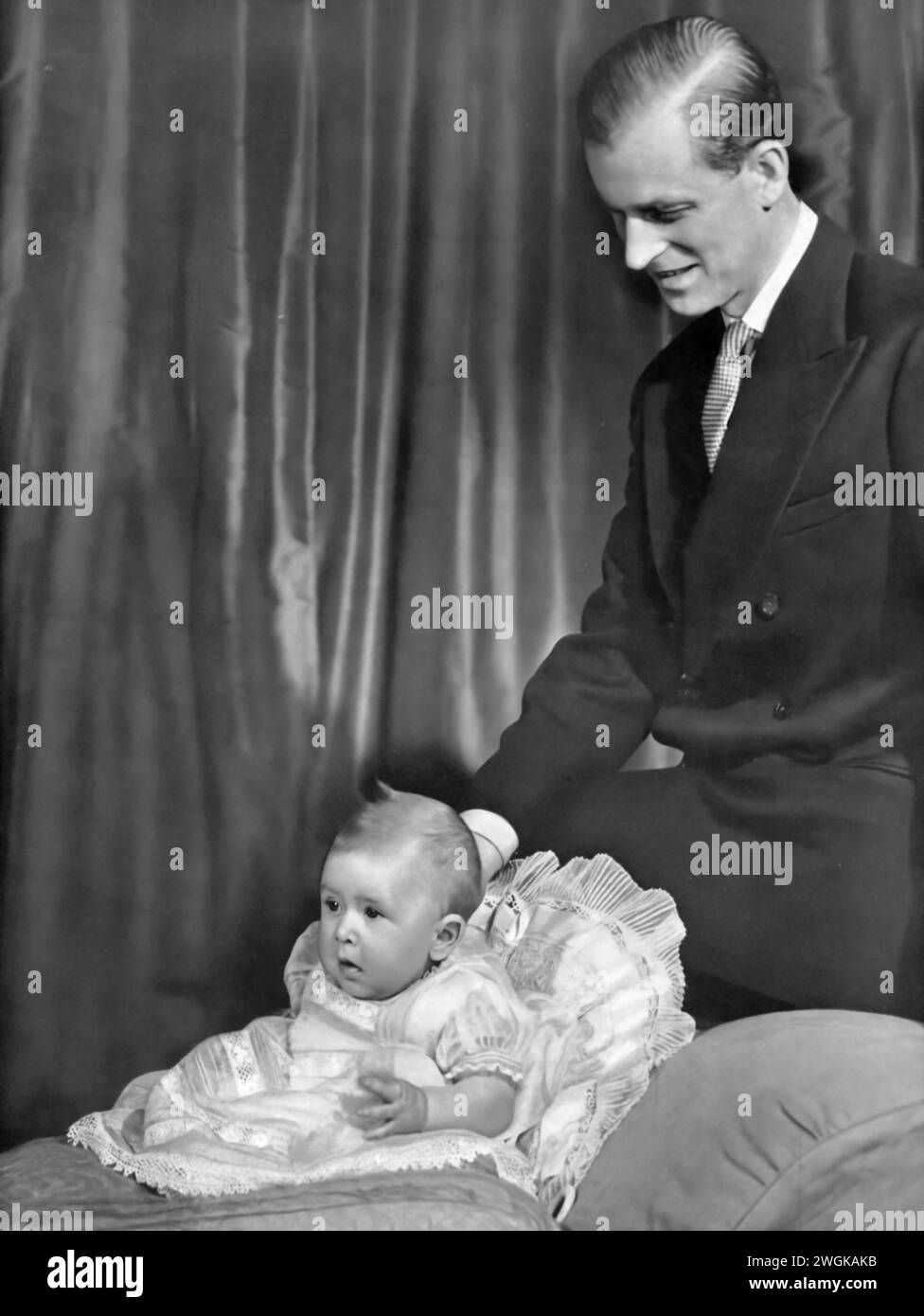 A photograph of Prince Philip with his newborn son, Charles III. Taken ...