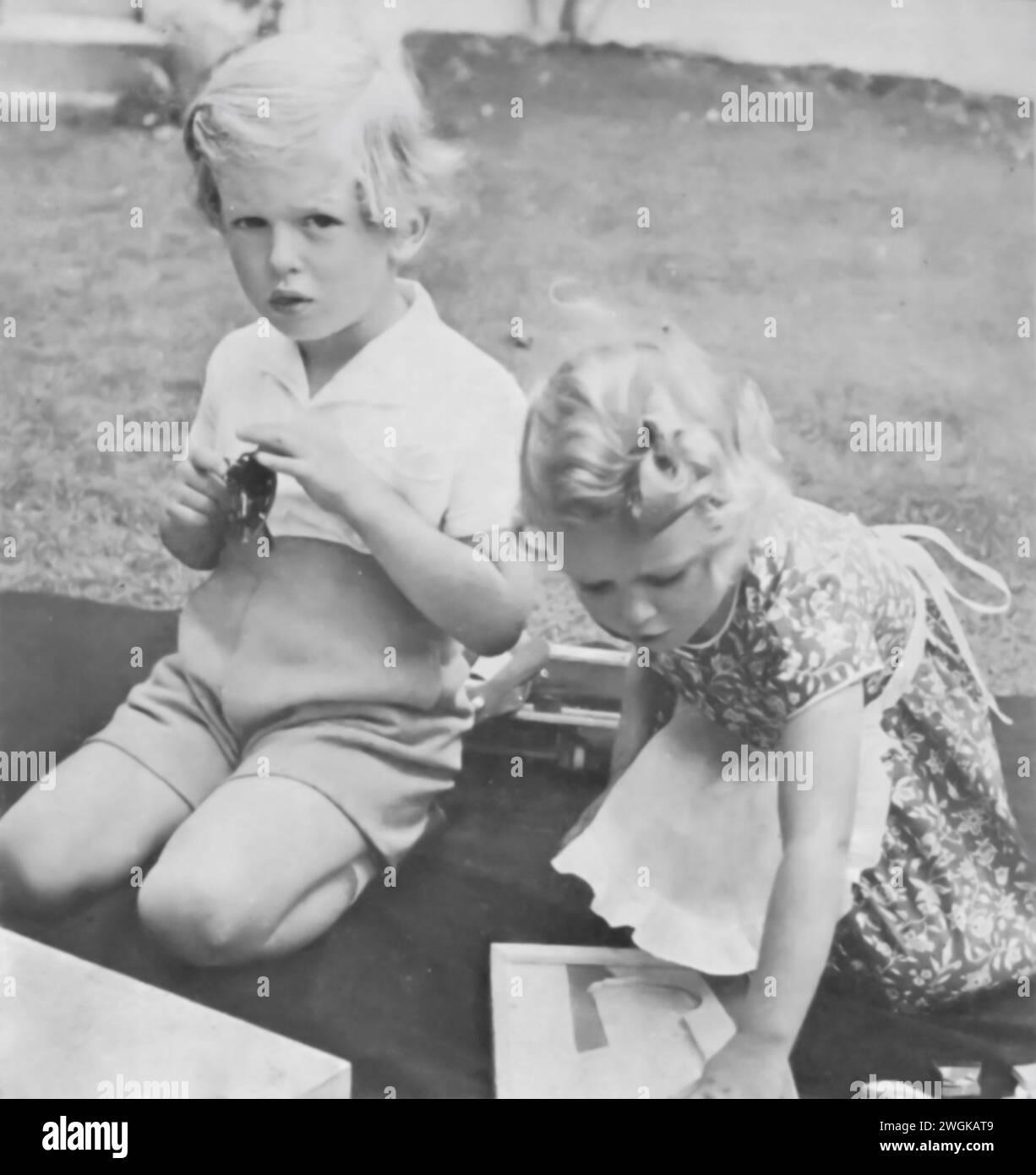 Photograph of Princess Alexandra and Prince Edward playing on the lawn ...