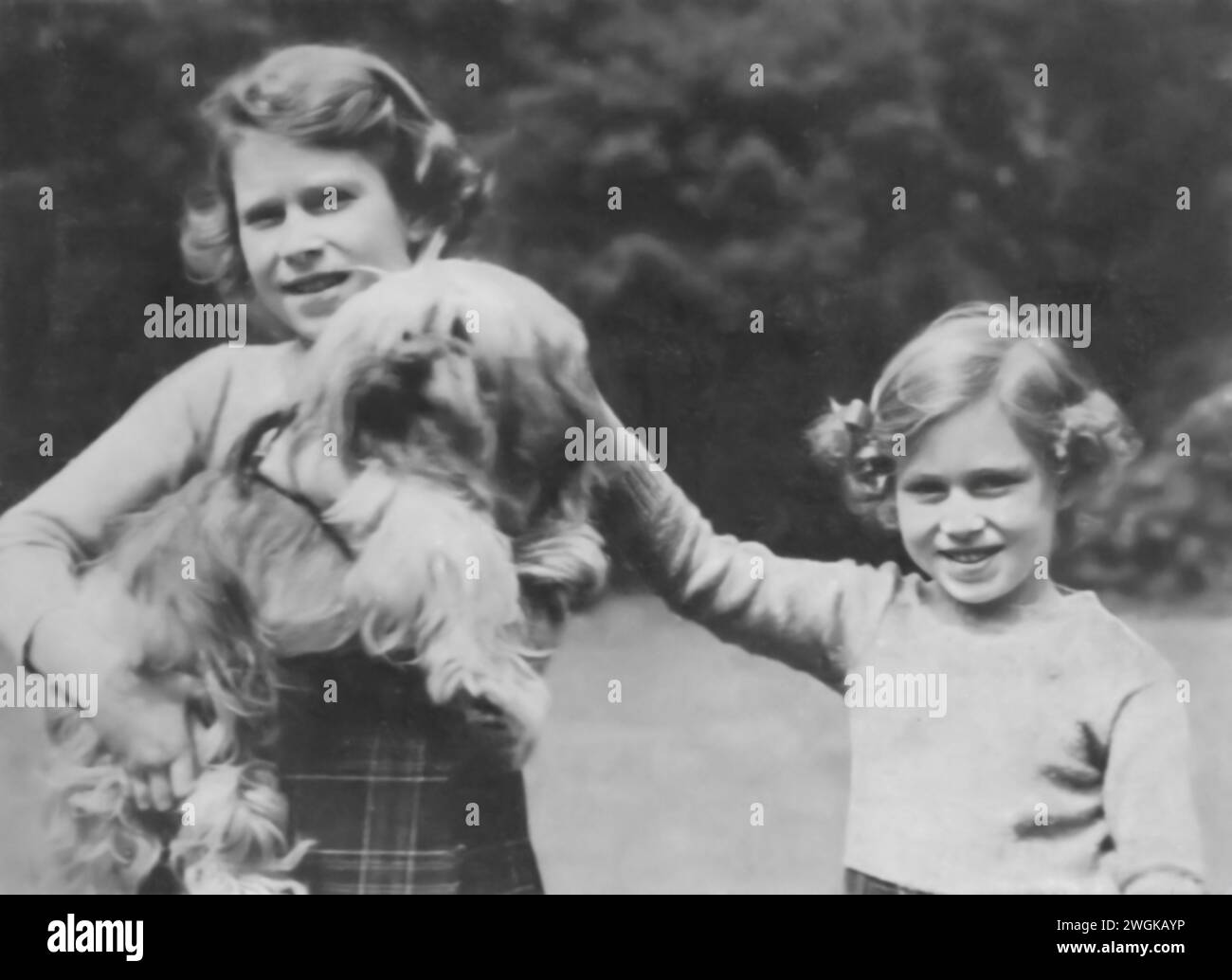 A photograph of Elizabeth II with her sister, Princess Margaret, and ...
