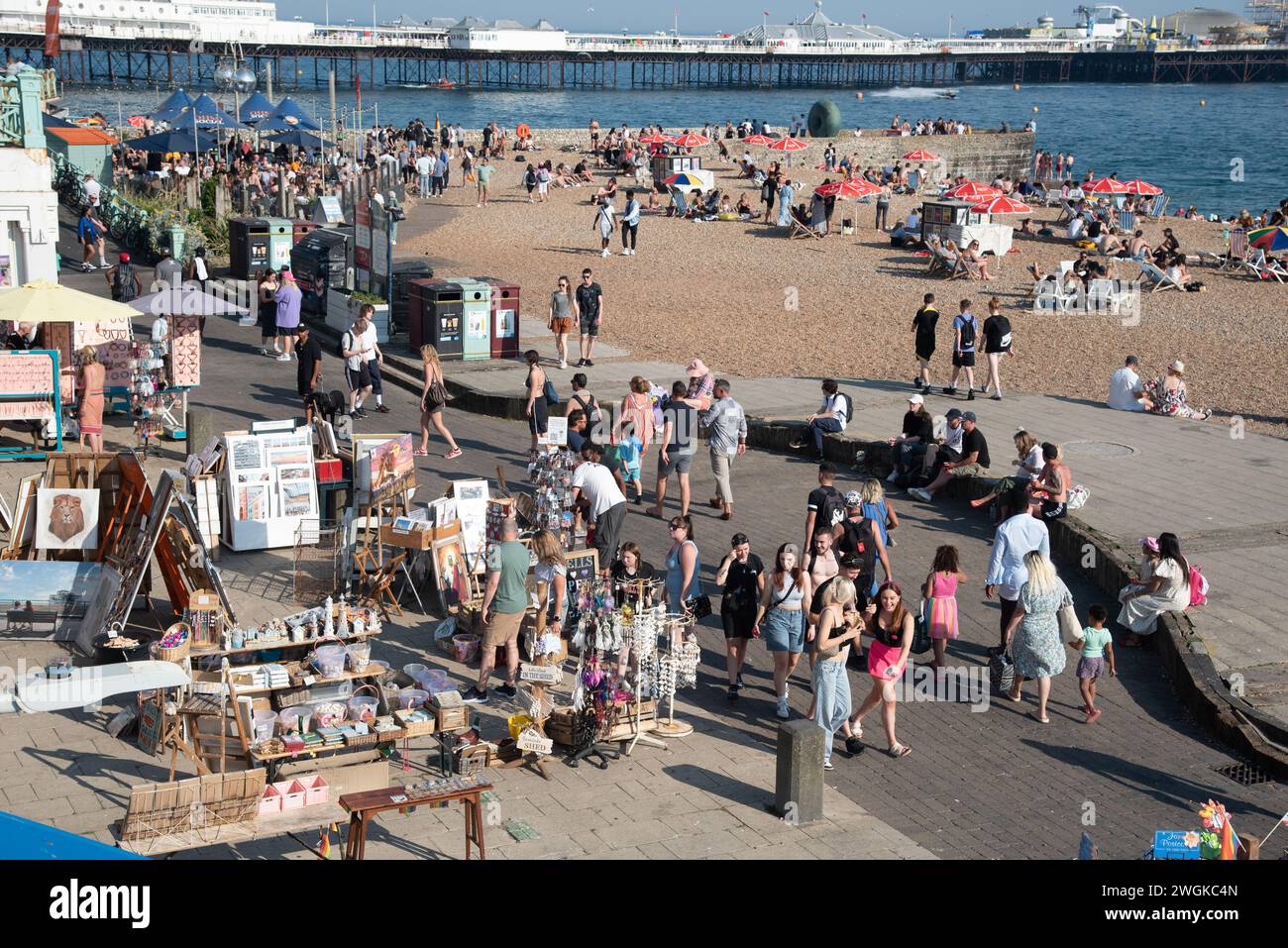 Crowd of british people walking and having fun at brighton town ...