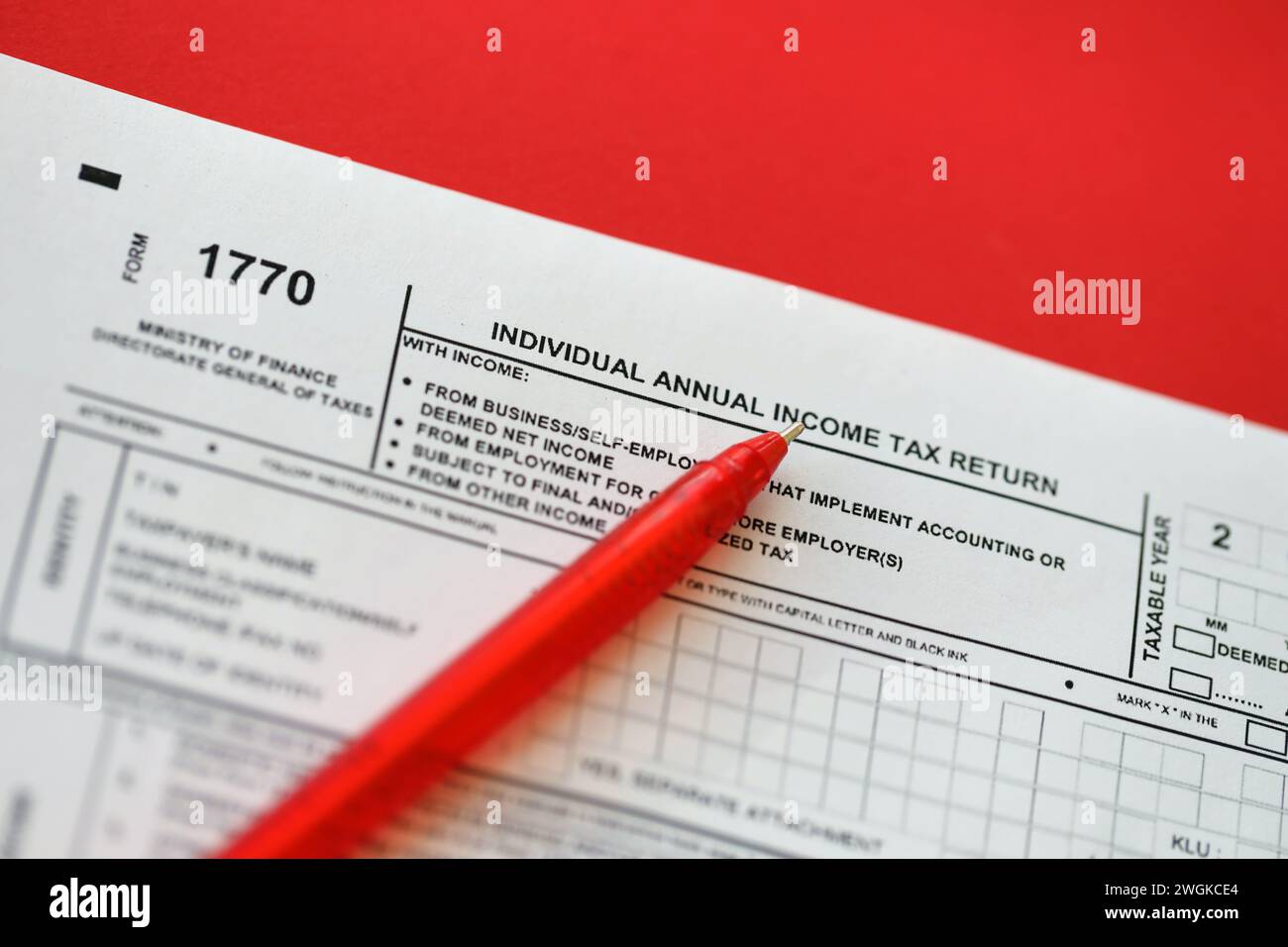 Indonesian tax form 1770 Individual Income Tax Return and pen on table ...