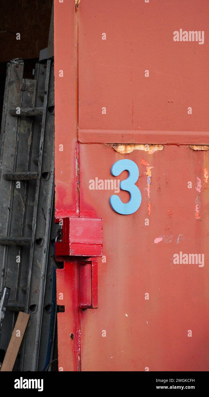 Secure bright orange door hi-res stock photography and images - Alamy