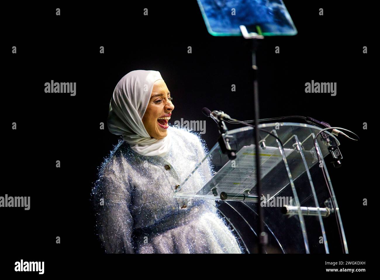 Boshra Gjam presenting awards on stage Stock Photo - Alamy