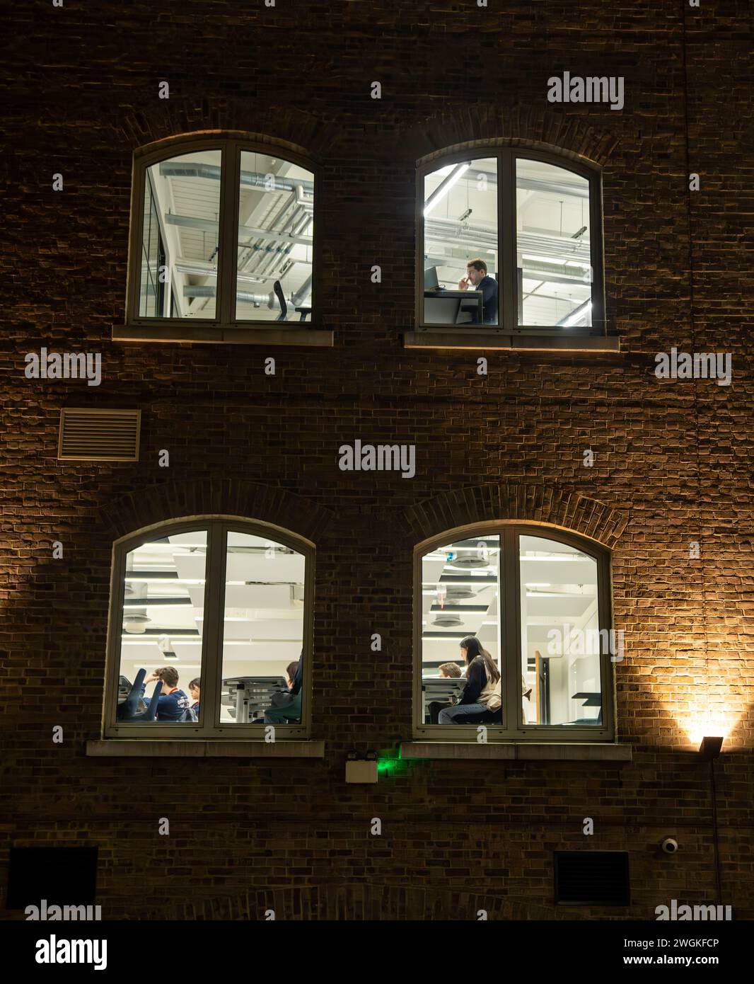 People at work in London working till late hours Stock Photo - Alamy