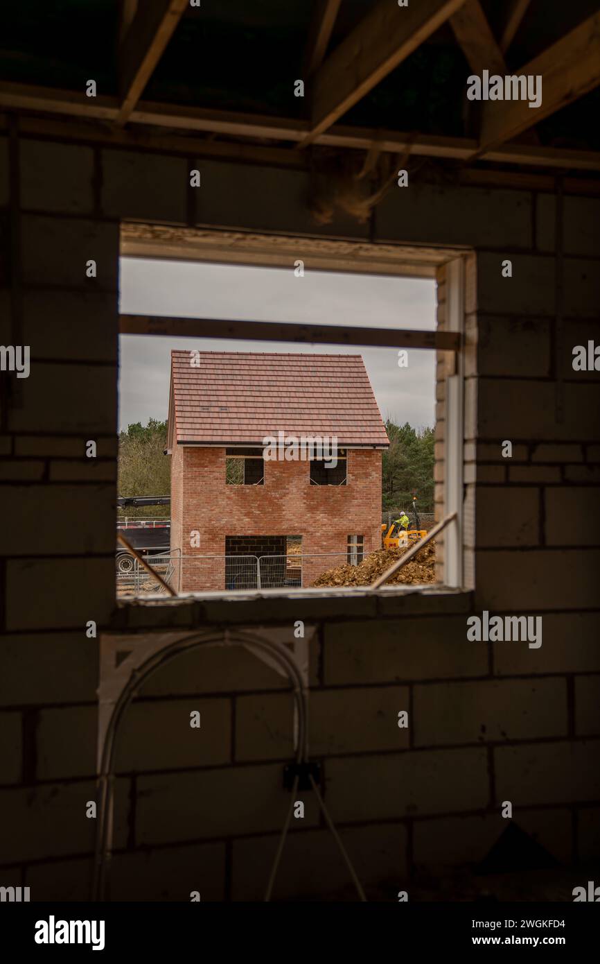 New build house view through a window of another house Stock Photo - Alamy