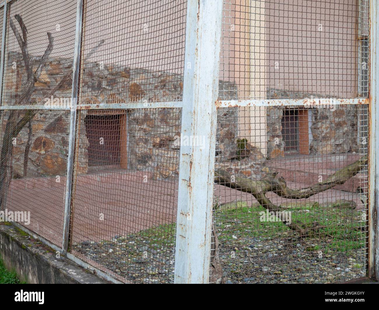 Outdoor fence at the zoo. Empty cages in the zoo. Winter at the zoo ...