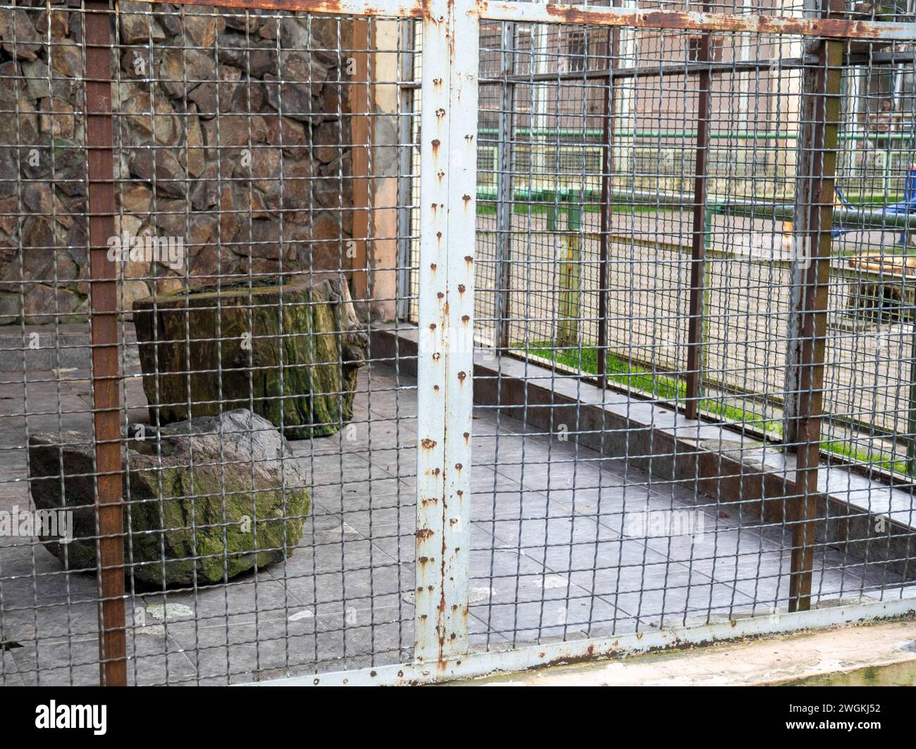 Outdoor fence at the zoo. Empty cages in the zoo. Winter at the zoo ...