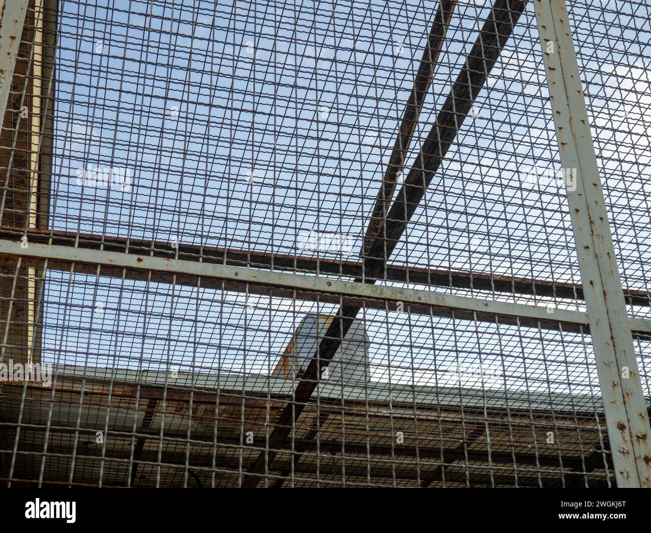 Outdoor fence at the zoo. Empty cages in the zoo. Winter at the zoo ...