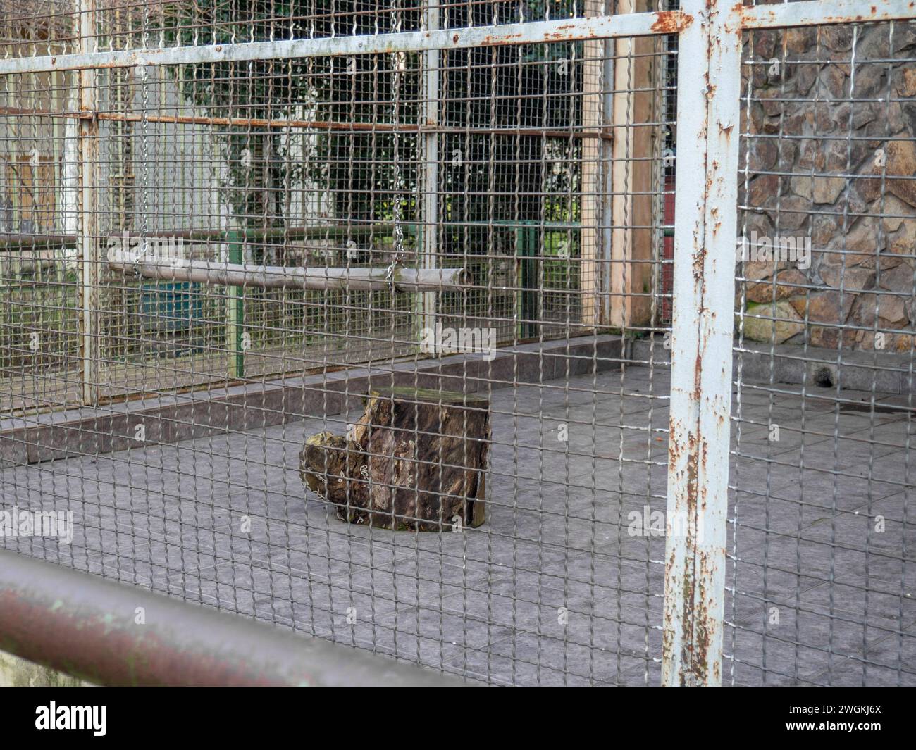Outdoor fence at the zoo. Empty cages in the zoo. Winter at the zoo ...