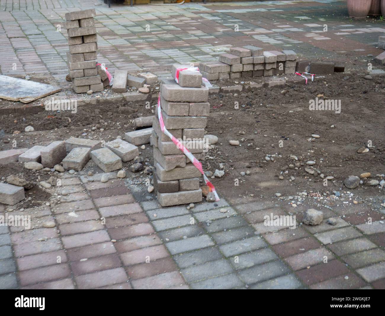 Renovation of the pedestrian zone. Excavation. Laying tiles outdoors ...
