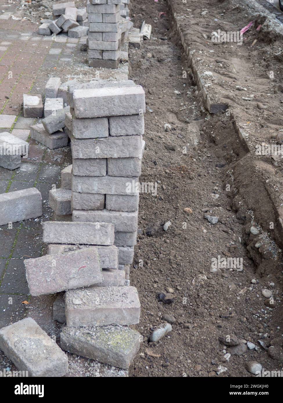 Renovation of the pedestrian zone. Excavation. Laying tiles outdoors ...