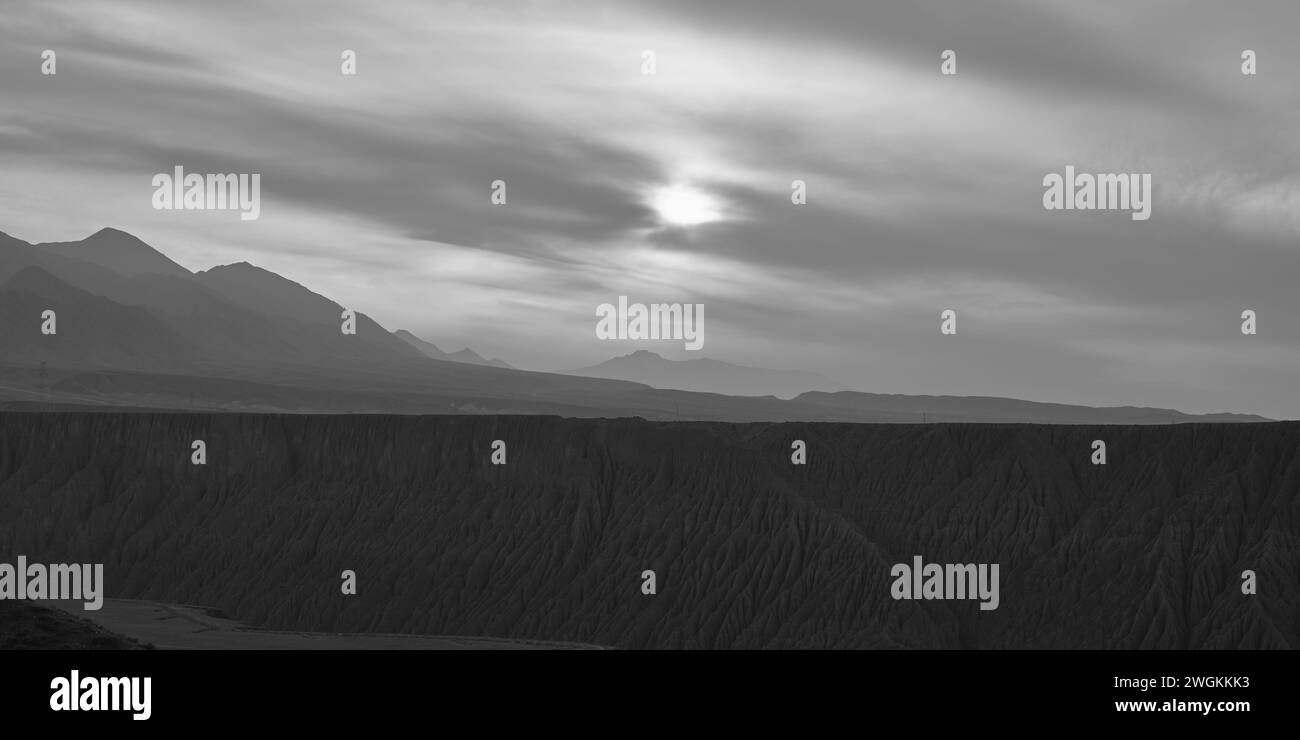 sunrise at the Dushanzi Grand Canyon in Xinjiang, China, black and ...