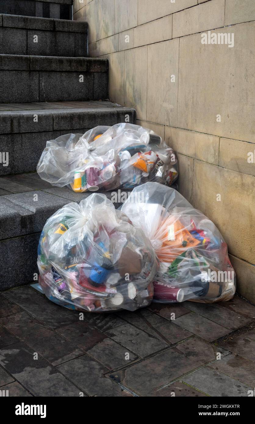 3 trash bags life on steps Stock Photo - Alamy