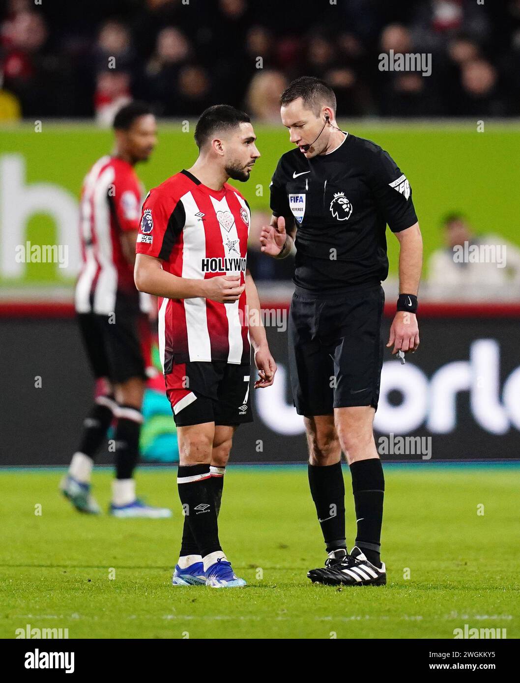 Referee Jarred Gillett speaks to Brentford's Neal Maupay during the ...