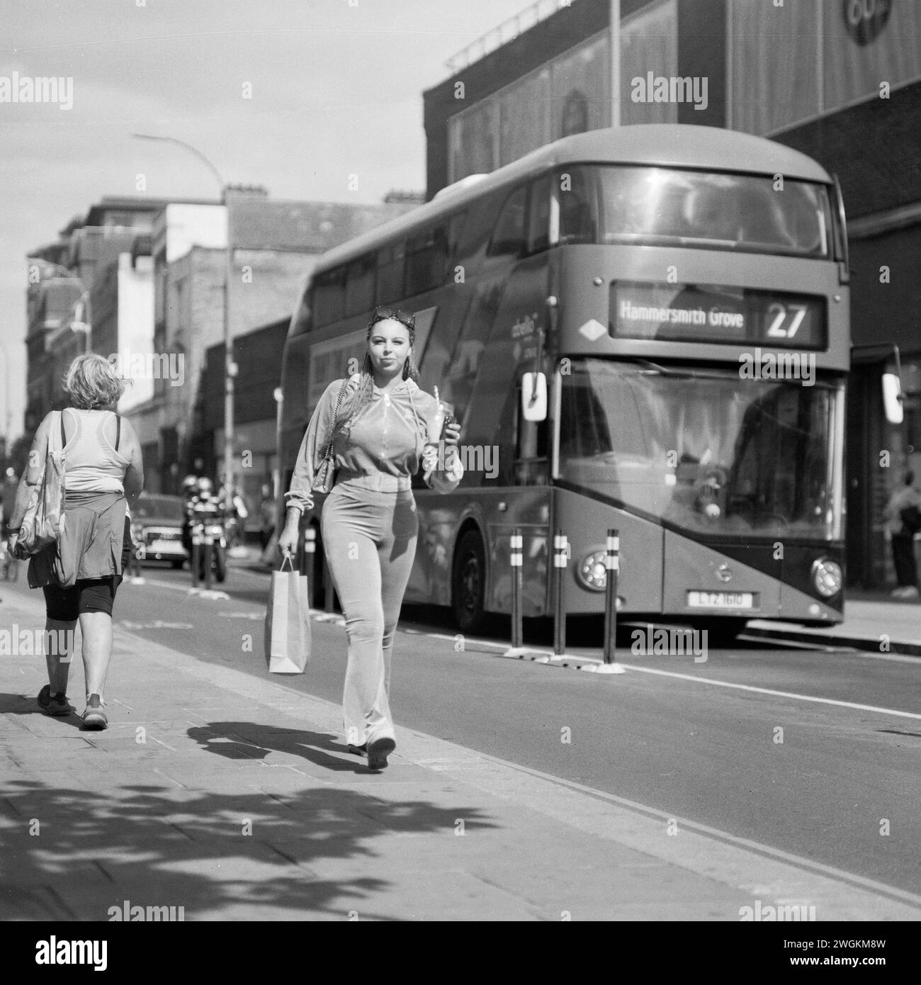 Pretty woman shopping on King Street, Hammersmith, London Stock Photo ...