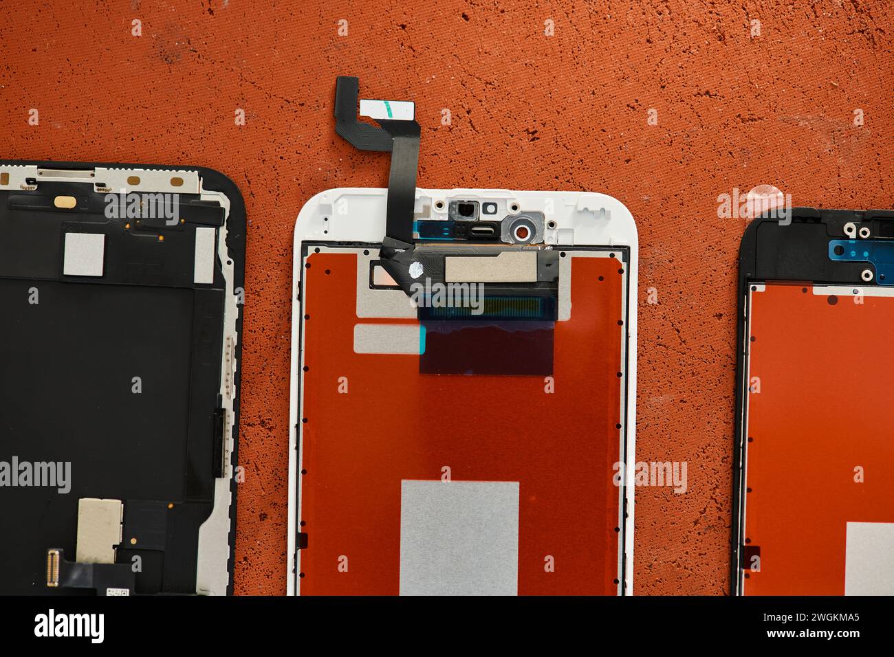 top view of new spare screens on table in repair workshop, maintenance ...