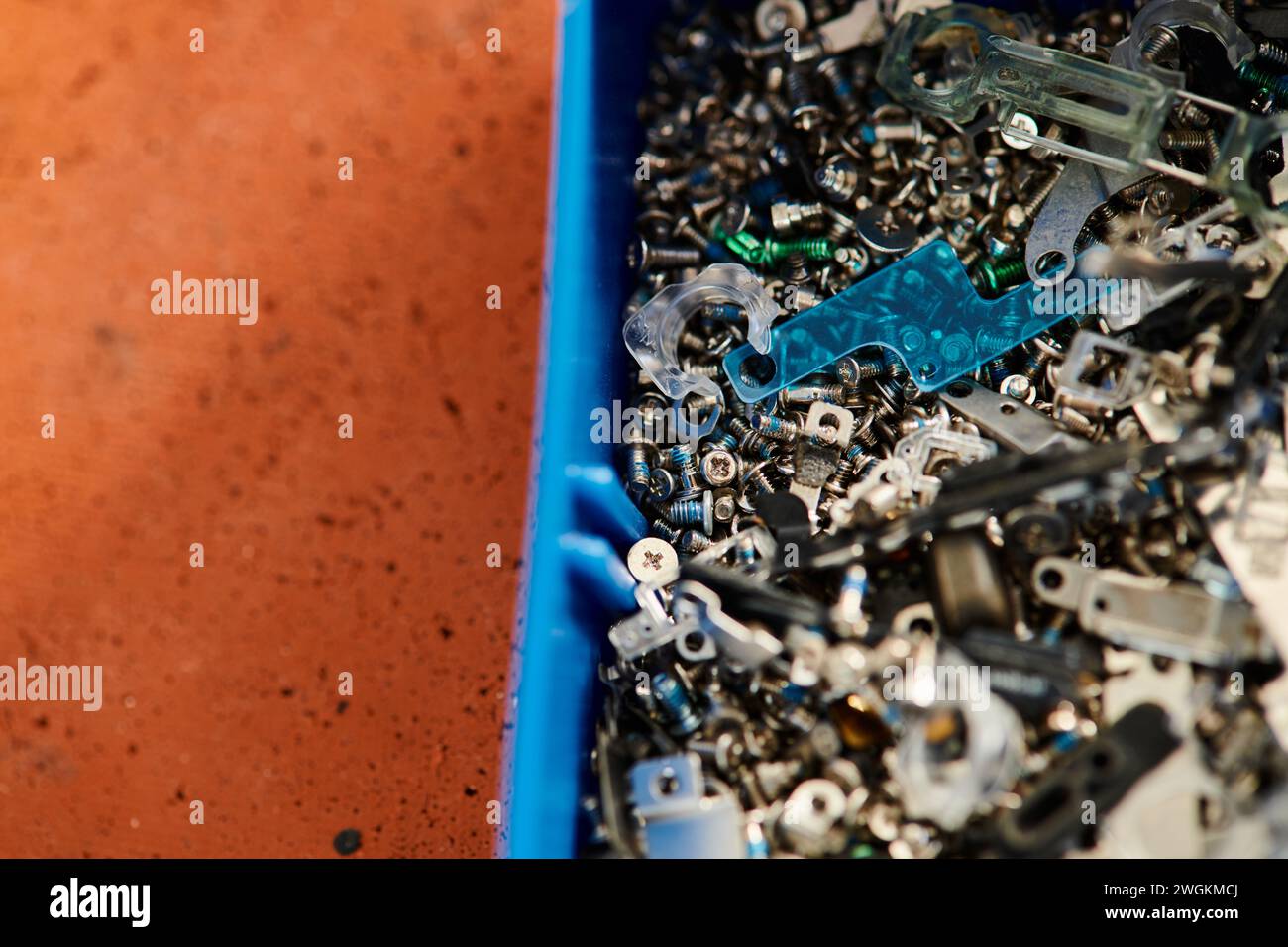 top view of various spare parts for electronic devices in repair shop ...
