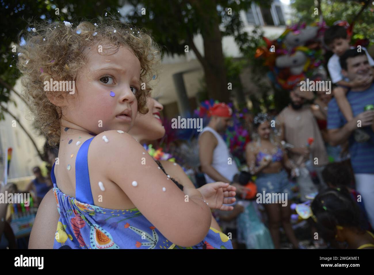 Kids street carnival parade in Rio de Janeiro. Revelers wearing ...