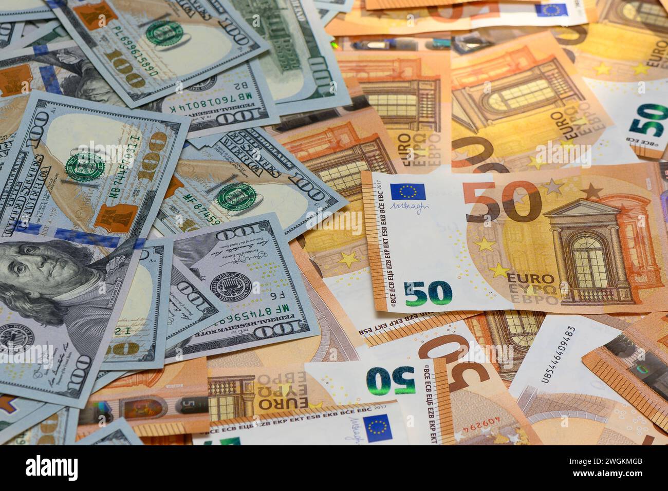 50 euro and 100 dollar bills scattered on the table as a background 21 ...