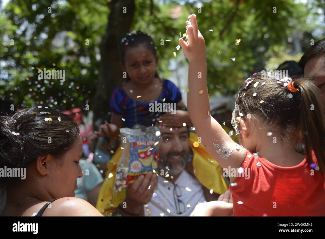 Kids street carnival parade in Rio de Janeiro. Revelers wearing ...