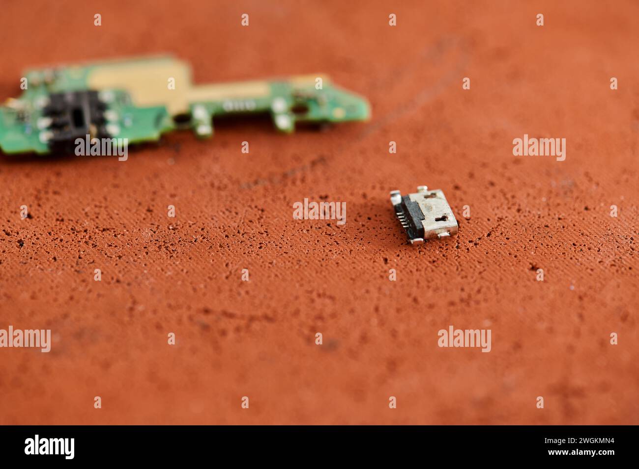 different spare parts for electronic equipment on table in repair ...