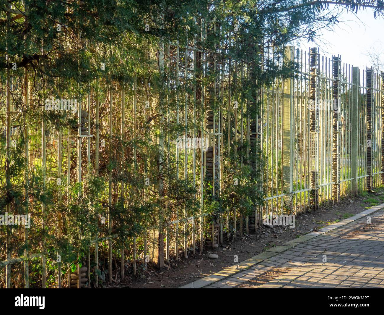 Empty animal enclosure. Outdoor fence at the zoo. Empty cells. Winter ...