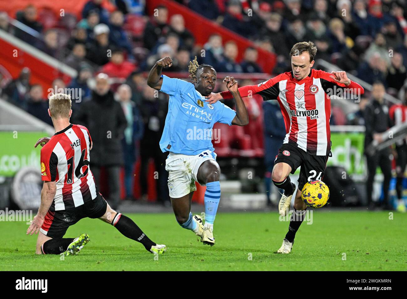 Jérémy Doku of Manchester City is stopped by Mikkel Damsgaard of ...
