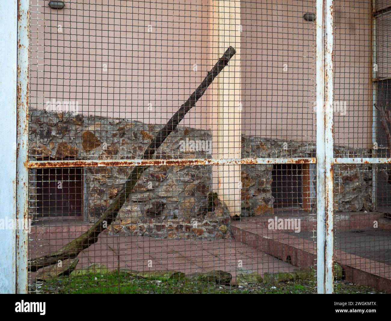 Outdoor fence at the zoo. Empty cages in the zoo. Winter at the zoo ...