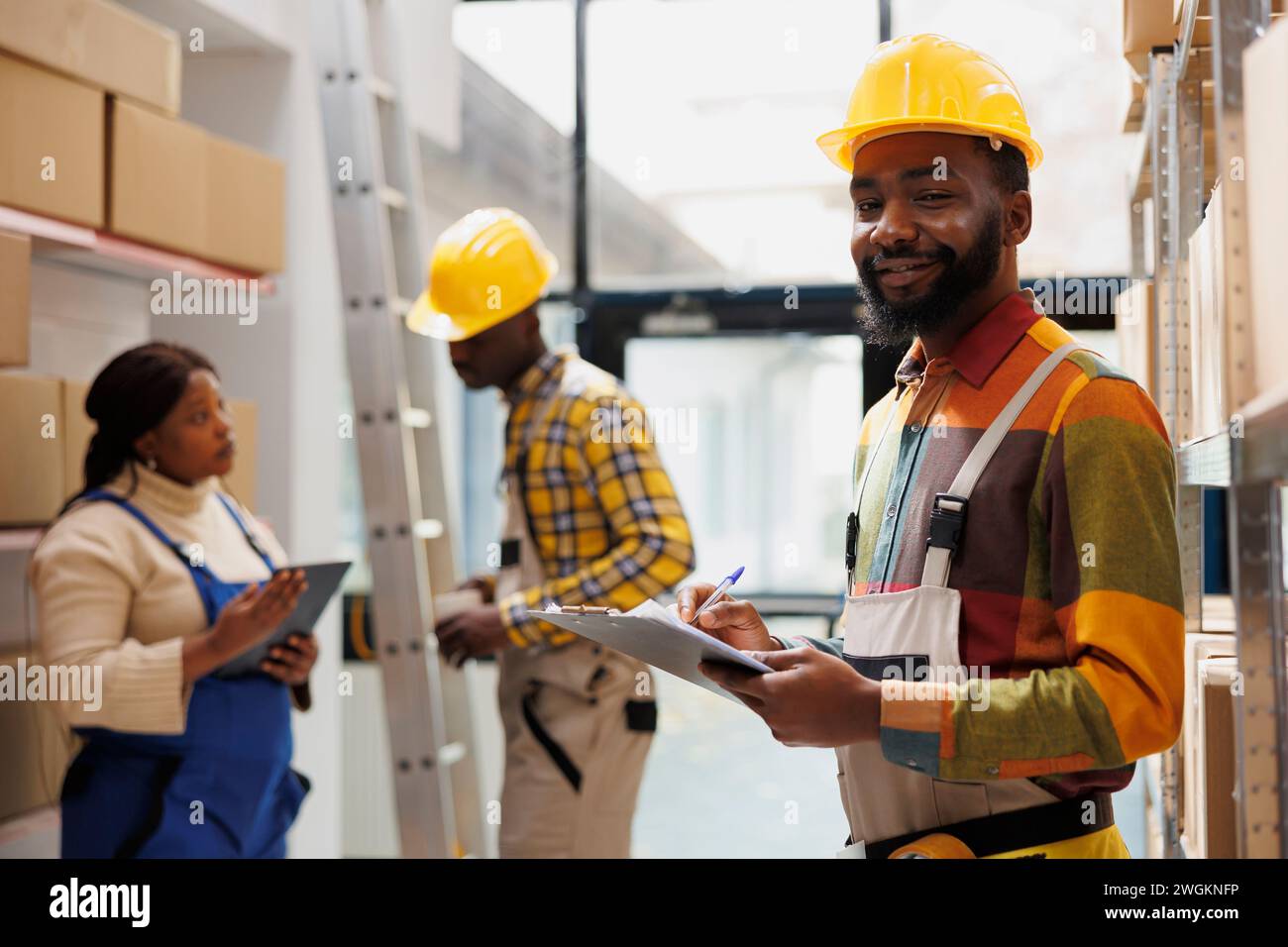 African american stock supply manager doing goods inventory in ...