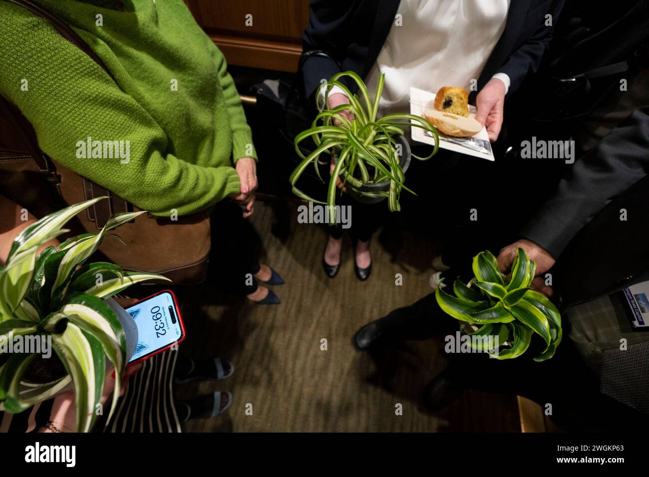 Members of the Oregon House of Representatives carry plants they ...