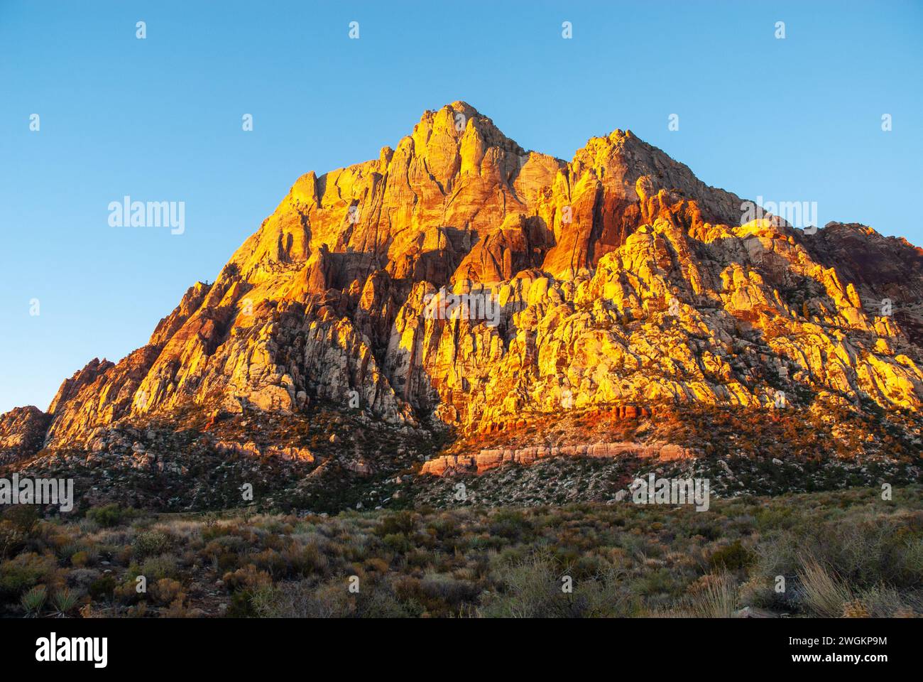 Mt Wilson looms above the desert floor of Red Rock Canyon National ...