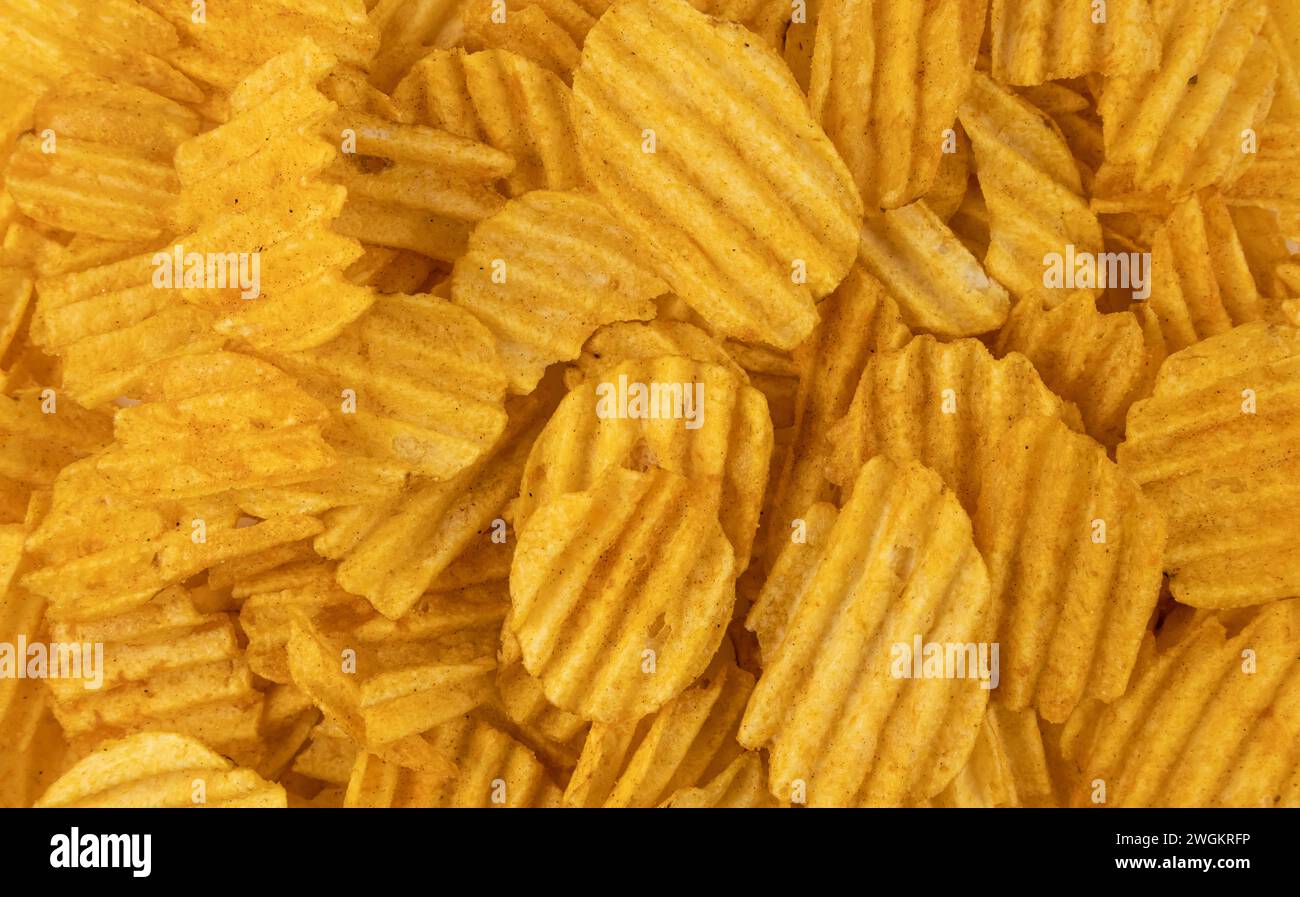 Corrugated potato chips. Chips as a screen saver, a beer snack Stock ...