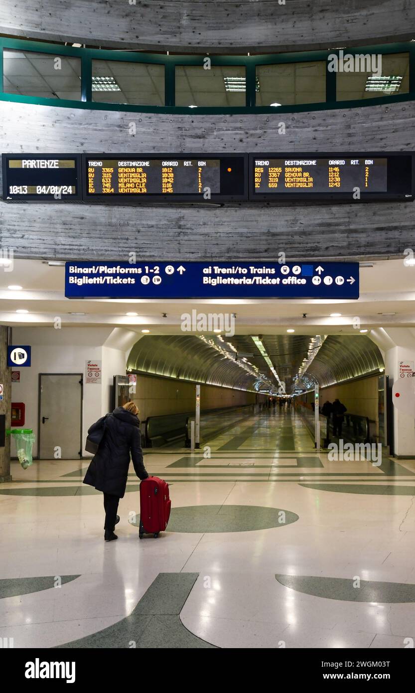 Railway station with electronic billboard of arrivals and departures ...