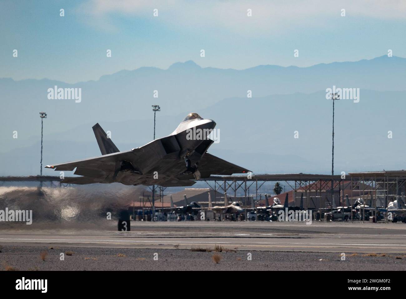 A U.S. Air Force F-22 Raptor assigned to the 90th Fighter Squadron ...