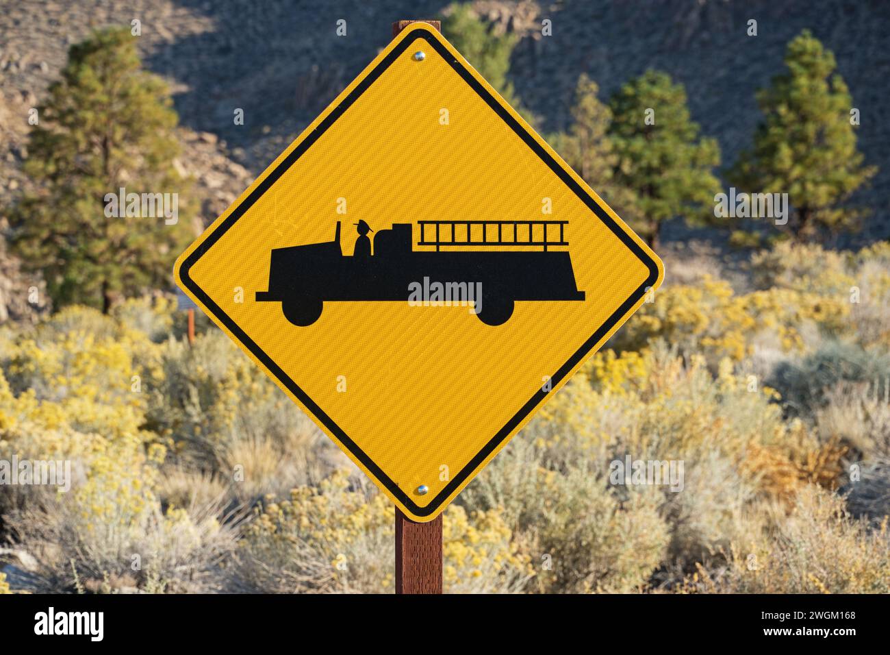 yellow and black fire station warning road sign Stock Photo - Alamy