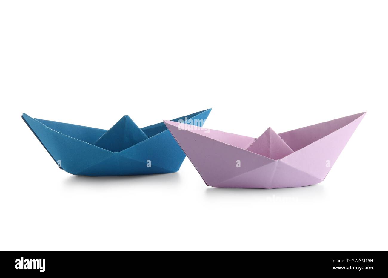 Colorful origami boats on white background Stock Photo - Alamy