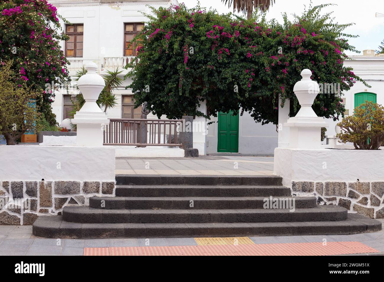 Typical buildings from Teguise, with white houses and blue doors ...