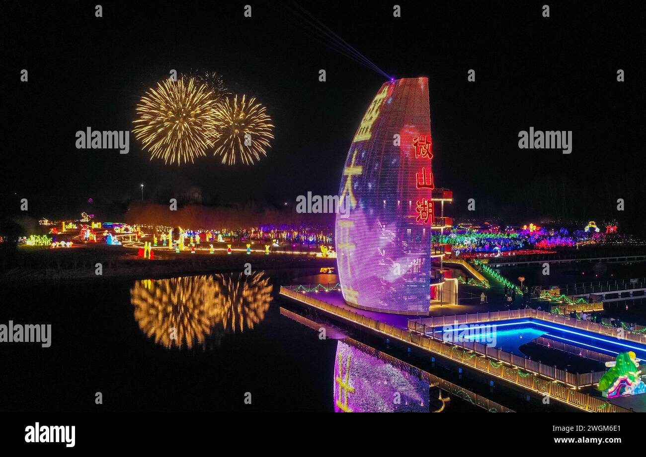 TENGZHOU, CHINA - FEBRUARY 3, 2024 - Visitors watch fireworks at the ...