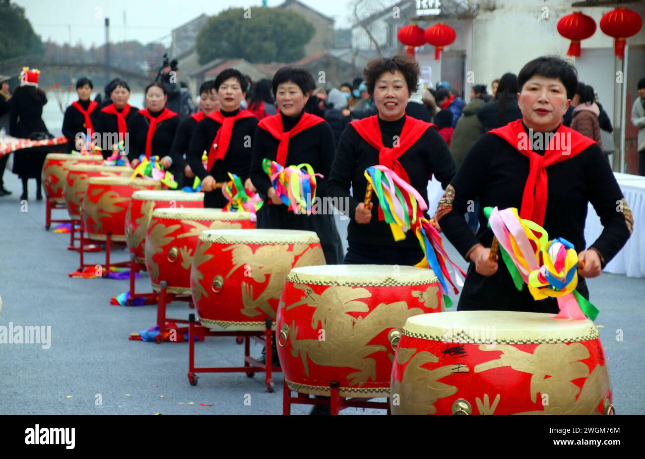 SUZHOU, CHINA - FEBRUARY 5, 2024 - Folk artists play drums during a ...