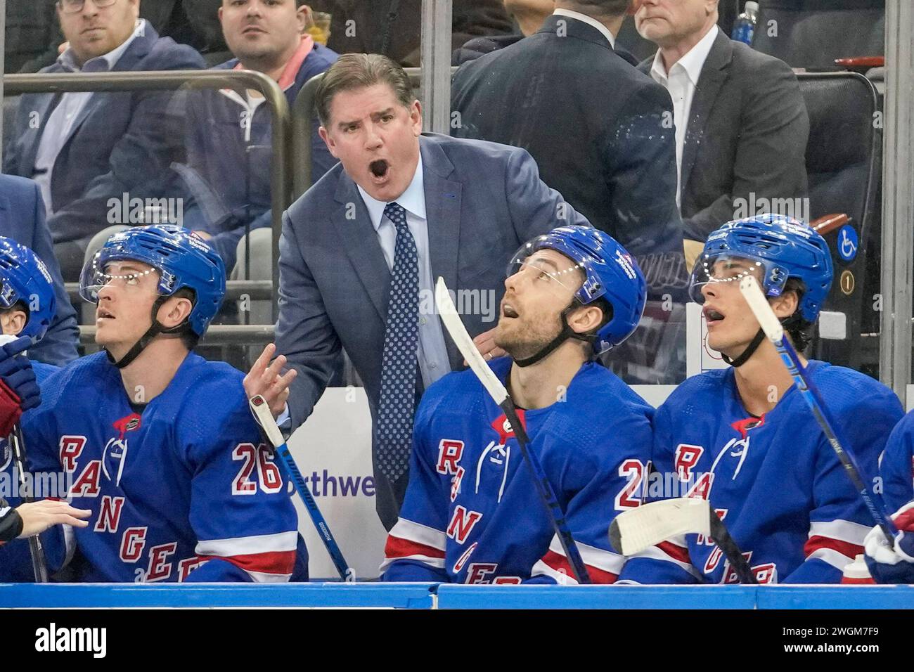 The New York Rangers head coach Peter Laviolette, center top, reacts during the first period of ...