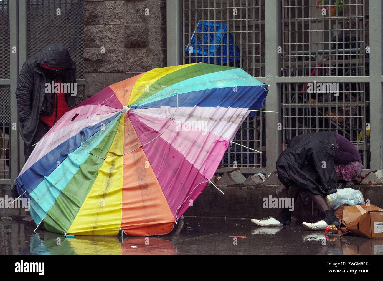 Homeless people crouch down under extreme weather outside the Union ...