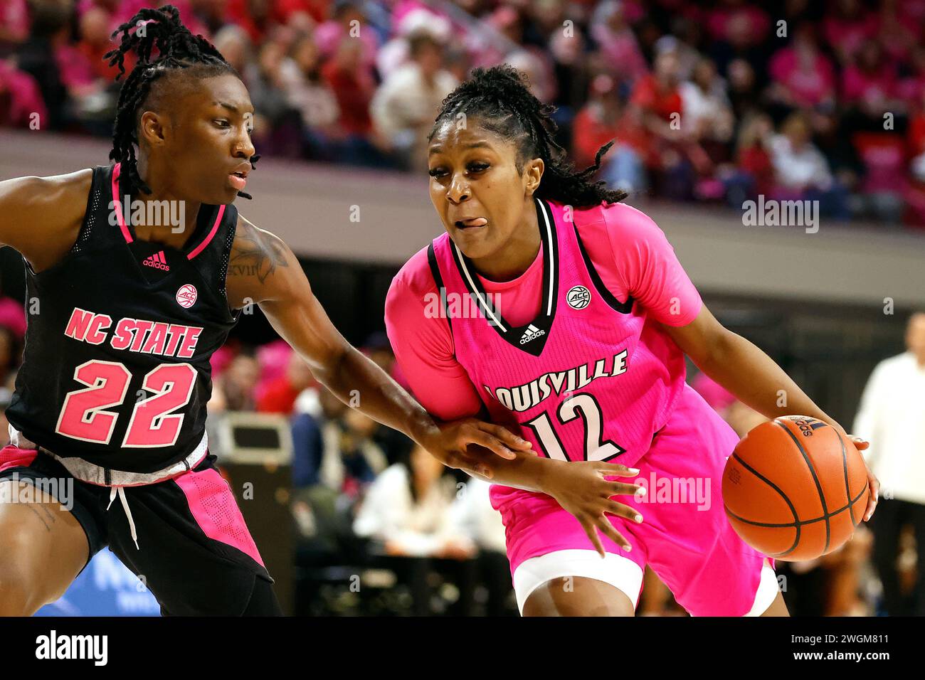 Louisville's Kiki Jefferson (12) drives the ball around North Carolina ...