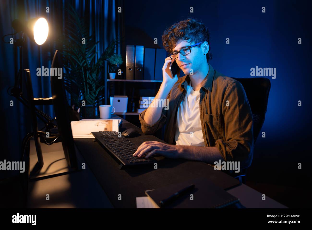 Young businessman calling on smartphone to customer or coworker ...