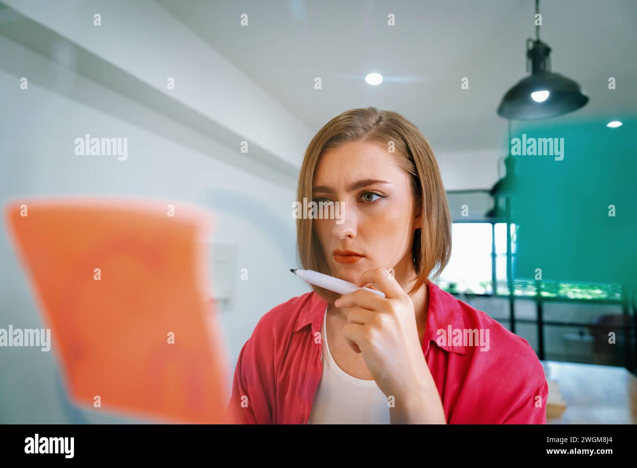 Portrait of young caucasian businesswoman thinking with confused face ...